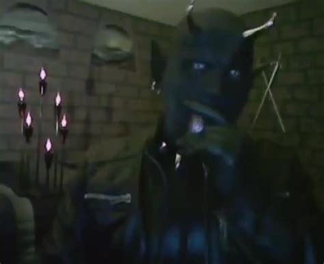 Devil Satan Smokes Stogie In Full Leather