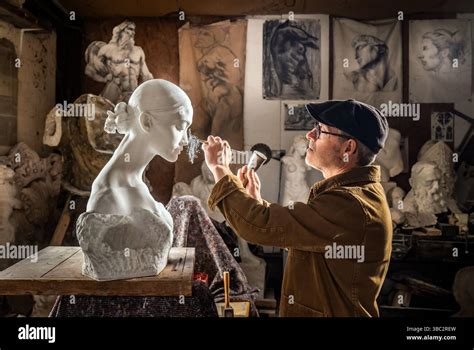 Award Winning Figurative Sculptor Andrian Melka Works On A Marble