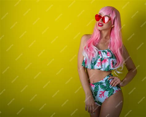 Premium Photo Beautiful Girl In A Pink Wig And Colored Bikini Posing