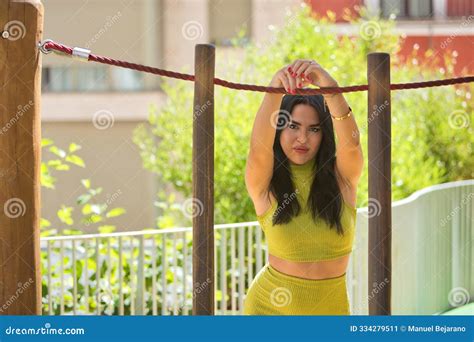 Young Beautiful Brunette Latina Woman Wearing A Green Suit With A