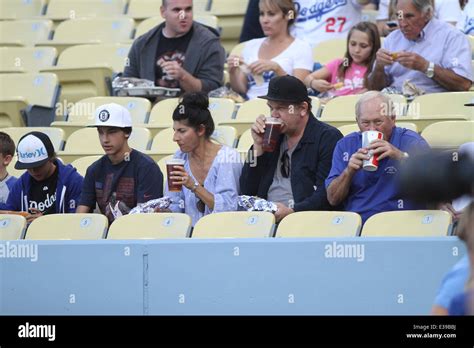 Celebrities At The Los Angeles Dodgers Baseball Game Featuring John C
