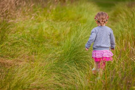 Walking Through The High Grass Premium Photo