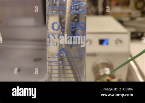 Nitrogen Bubble Through Organic Solvent In Measuring Cylinder In A Chemistry Lab For Education