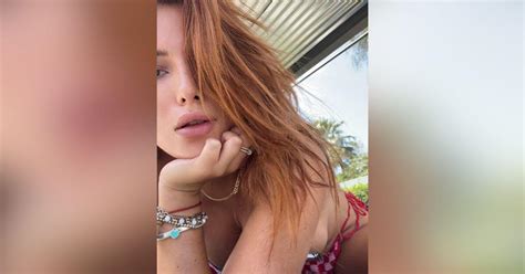 Bella Thorne Nearly Spills Out Of Tiny Bikini Photos
