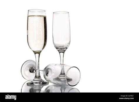 Glass Of Champagne And Empty Champagne Glass On White Background Stock