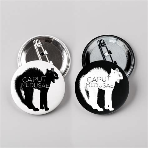 Black Cat Button W Caput Medusae Logo Caput Medusae