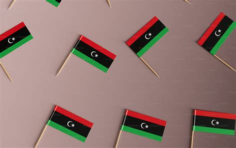 A Group Of Small Flags Sitting On Top Of Toothpicks Photo Wallpaper Image On Unsplash