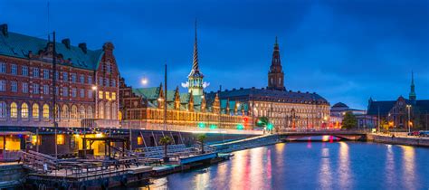 Copenhagen Historic Spires Of Slotsholmen Waterfront Illuminated Dusk
