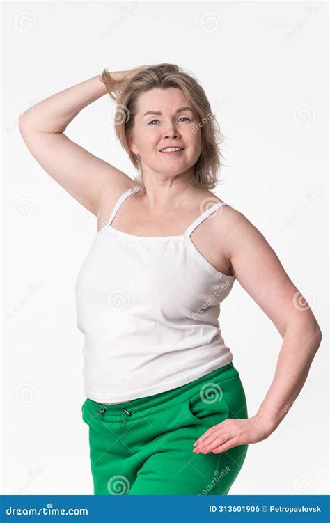 Portrait Of A Happy Plump Mature Adult Blonde Woman With Medium Length