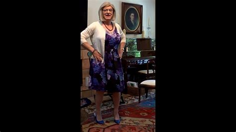 Mature Crossdresser Wearing A Blue Hydrangea Dress With A Cardigan