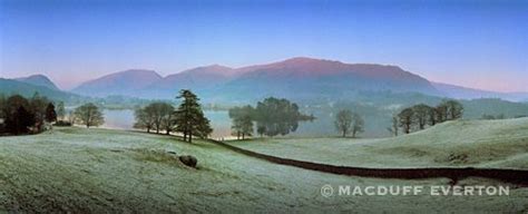 A Landscape With Mountains And Trees In The Background
