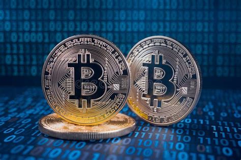 Two Gold Bitcoin Coins With Binary Backdrop Symbolizing Digital Currency Value Stock