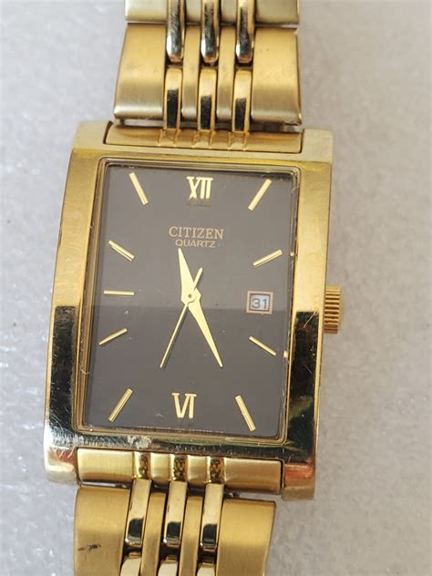 Vintage Mens Gold Tone Citizen Quartz Watch With Date Slot N Rectangular Shaped Wblack Face