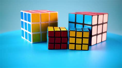 Conceptual Large And Small Rubiks Cube Rotate 7711398 Stock Video At