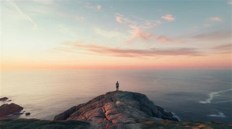 Premium Photo Silhouetted Philosopher Overlooking Ocean Standing On Cliff During Peaceful Sunset