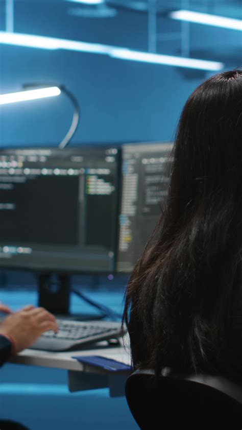 Vertical Diverse It Engineers In Server Room Brainstorming Ways To Fix Equipment Storing