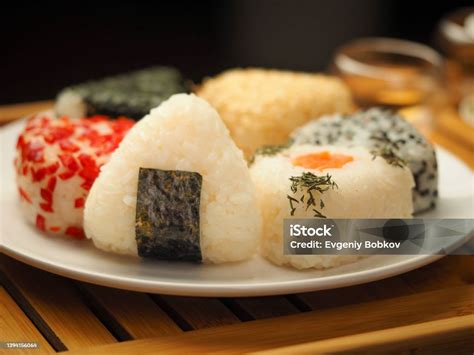 Onigiri Of Various Shapes And Fillings On A Plate Closeup Food Photo