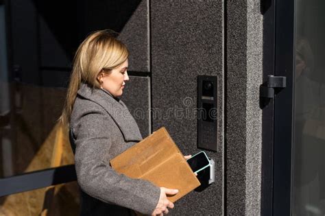 Woman Using Intercom At Building Entrance Stock Image Image Of Hand Open 310913643