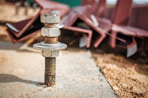 Reinforced Concrete Foundation Showcasing Embedded Parts And Bolts On A