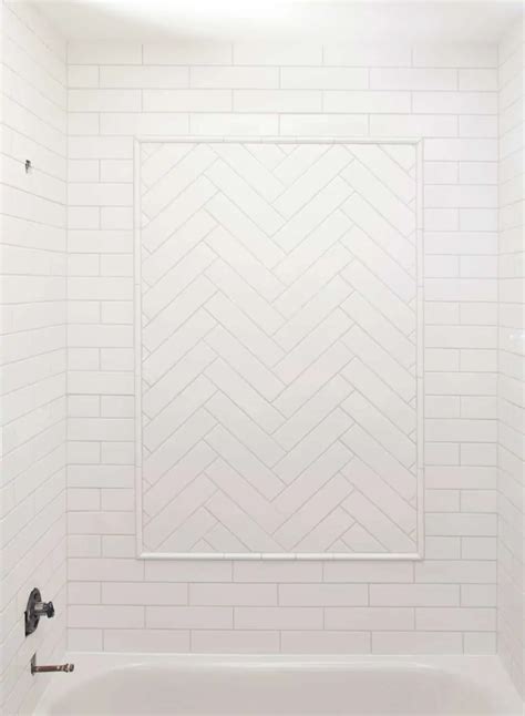 Herringbone Tile Pattern Inset In Subway Tile In A Bathtub Or Shower