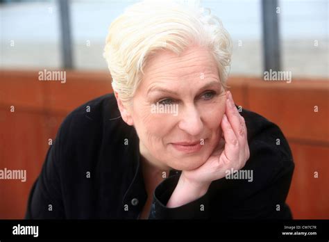 Portrait Of An Attractive White Haired Woman Smirking With The Head