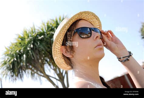 Young Woman 20s Wearing Ray Ban Sunglasses And Straw Truly Style Hat