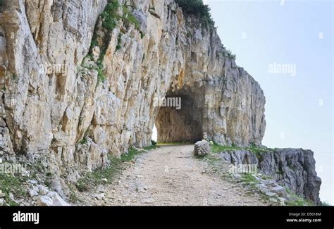 Mountain Pass Traversed By A Path Drilled In The Rocky Mountain Stock