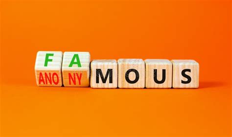 Famous Or Anonymous Symbol Concept Word Famous And Anonymous On Wooden Cubes Beautiful Orange