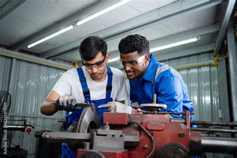An Industrial Engineering Team Wearing Safety Controls Operating A