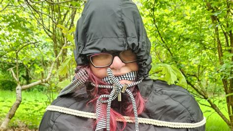 Struggling Woman Tied To Tree In A Raincoat Topofthepot Miss M