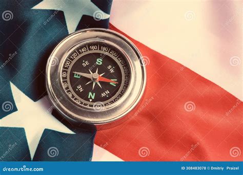 Compass Pointing West And Star Spangled Flag United States America