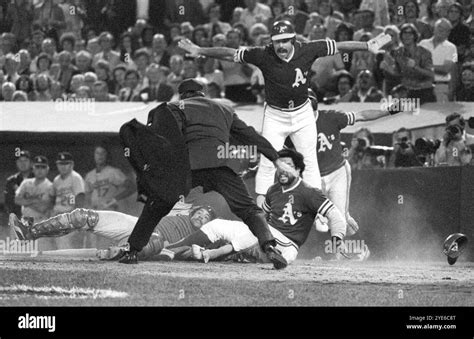 Oakland As Third Baseman Sal Bando Leaps With The Safe Sign As Right