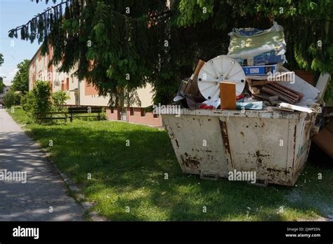 Large Waste Container Filled With Bulky Waste Old Furniture And Other