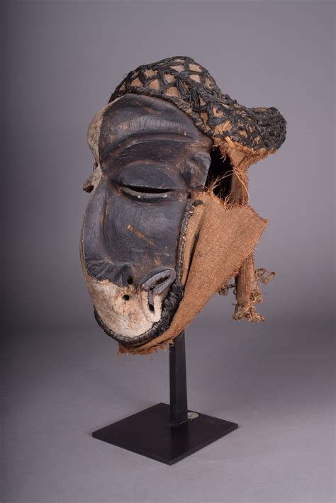 A Pende Sickness Mask Drcongo With A Distorted Face And With White