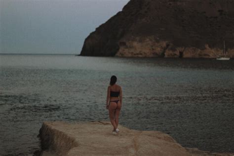 Premium Photo Rear View Of Teenage Girl In Bikini Walking At Beach