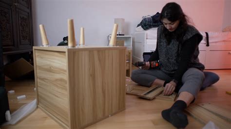 Woman Assembling Furniture At Home With Stock Footage Sbv 348936575