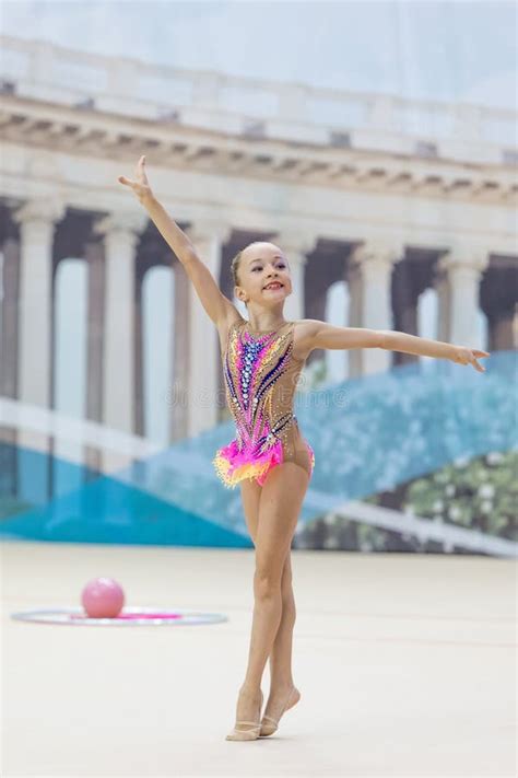 A Young Teenager Girl Performs At Competitions In Rhythmic Gymnastics