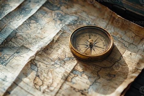 Old Compass Lying On Antique World Map Showing The Way To New