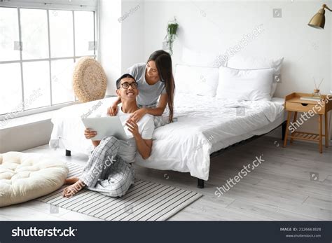 Стоковая фотография 2126663828 Young Man Laptop His Girlfriend Bedroom Shutterstock