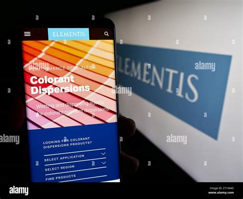 Person Holding Smartphone With Webpage Of British Specialty Chemicals