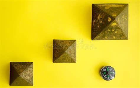 Pyramids And Compass On Yellow Background Stock Image Image Of Pyramids Exterior 118607291