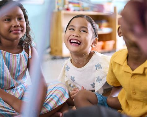 Primary Or Elementary School Class Having Fun With Model Wind Turbine Learning About Environment