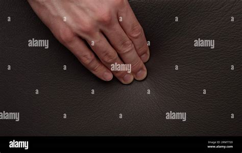 Closeup Man Checking Leather Quality On Furniture Straight Shot Stock