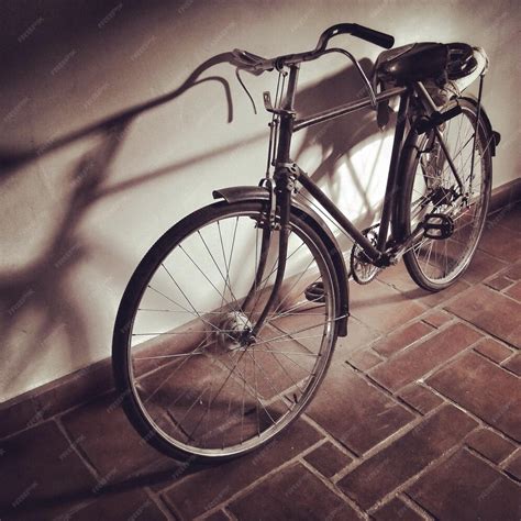 Premium Photo Bicycle Leaning Against A Wall