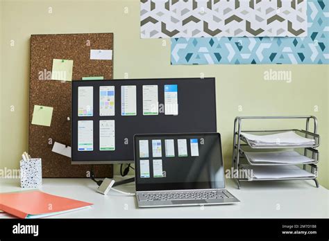 Background Image Of Minimal Home Office Setup With Computer Screen And Planning Charts Against