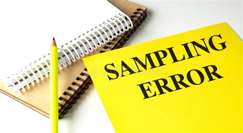 Sampling Error Text On A Yellow Paper Alongside Notebooks And A Yellow Pencil Stock Image