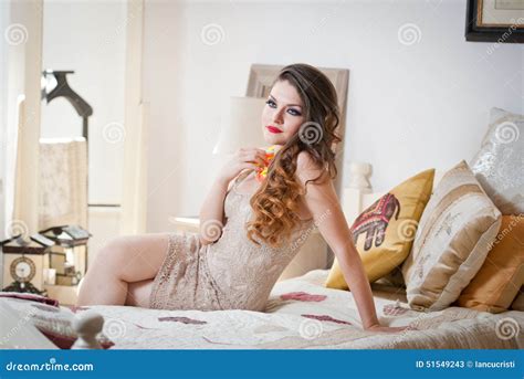 Young Beautiful Woman In White Short Tight Dress Posing Challenging