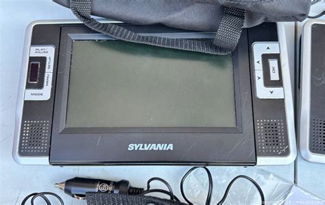 Pair Sylvania Sdvd8730 Portable Dvd Players With Accessories Maxsold