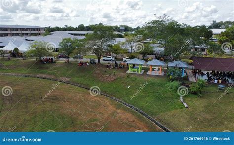 Aerial Of A Field Of Mrsm Kuching Sarawak With Trees And People Around