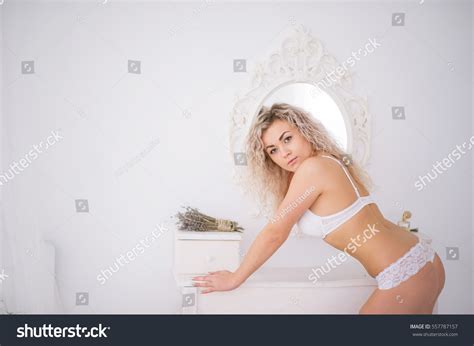 Wavy Blonde Bent Over In Soft Natural Light